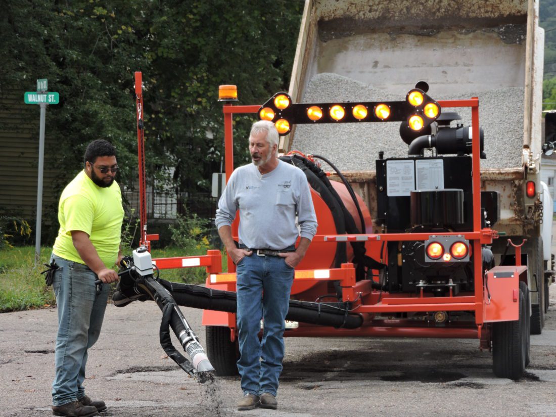 Workers train on repair machine | News, Sports, Jobs - The Times Leader